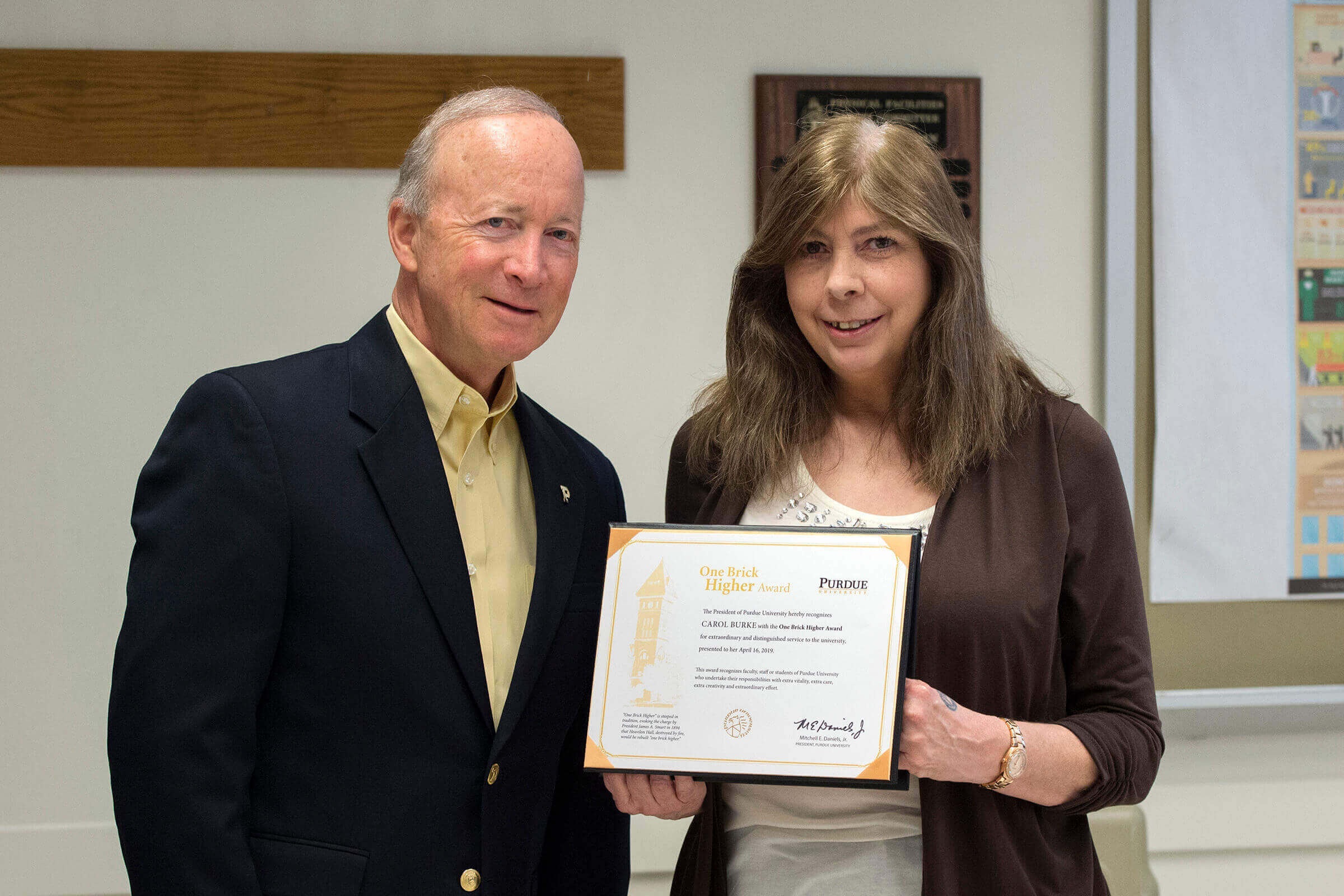 Daniels recognizes custodian Carol Burke with One Brick Higher Award ...